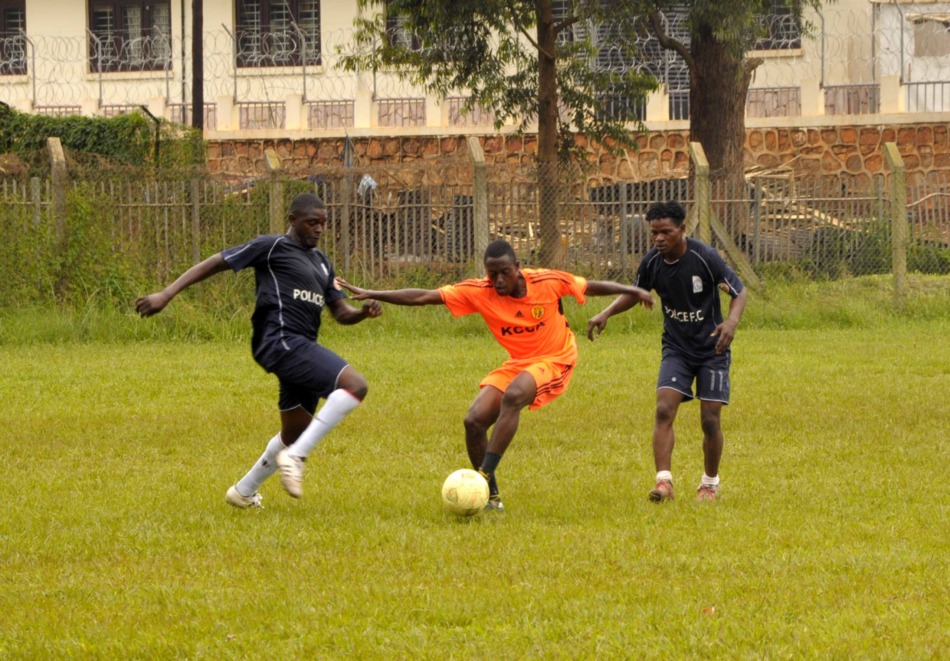 KCCA FC’s Brian Majwega (centre) is challenged by two Police FC player ...